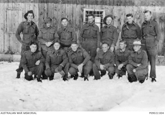 Group portrait of 13 Allied Prisoners of War (POW) at Stalag XVIIIa ...