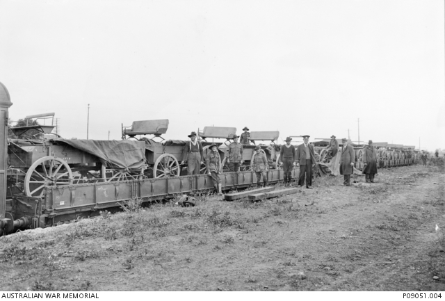 Soldiers and railway staff gather at a train loaded with Army Service ...