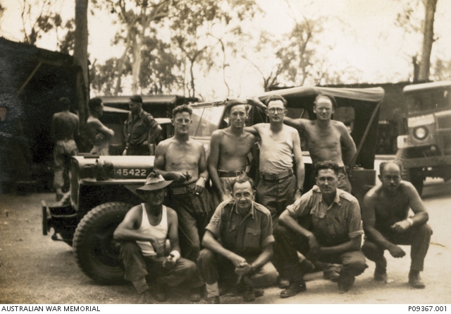 Group portrait of men of the 9th Division. Identified is NX26621 Staff ...