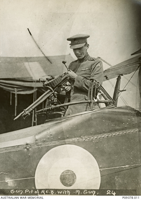 A pilot stands in the gunner's (observer's) position of an RE8 aircraft ...