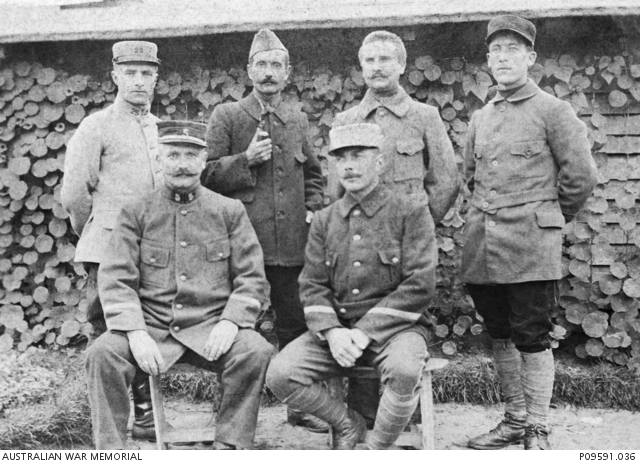Outdoor portrait of six unidentified Allied prisoners of war (POW). One ...
