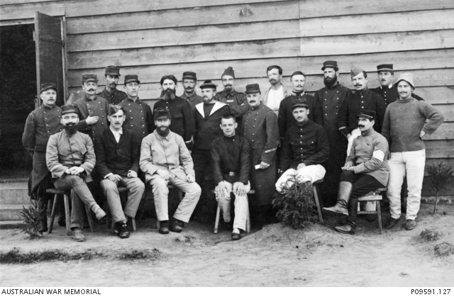 Outdoor group portrait of twenty-one unidentified allied prisoners of ...