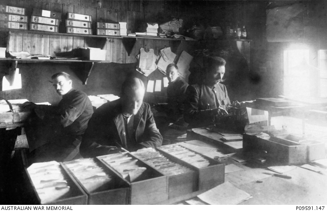 Four unidentified allied prisoners of war (POW) employed on clerical ...