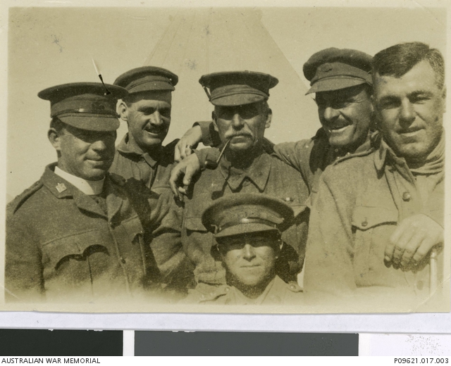 Informal group portrait of (left to right) Chaplain Thomas Mullins ...