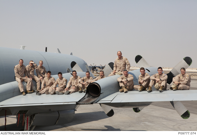 The crew of RAAF AP-3C Orion A9-755 on the wing of their aircraft at Al ...