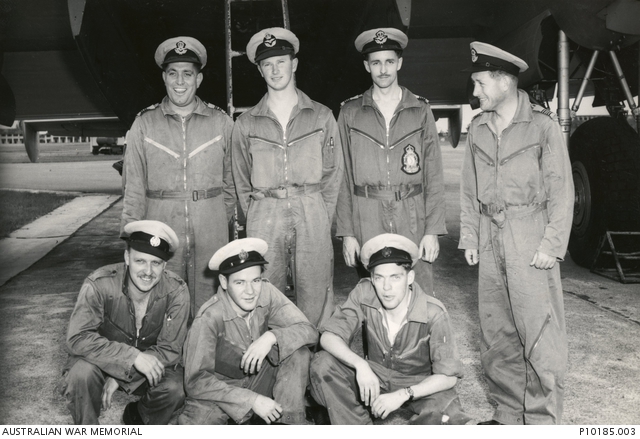 Group portrait of seven unidentified RAAF personnel 'Arrival of S/LDR ...