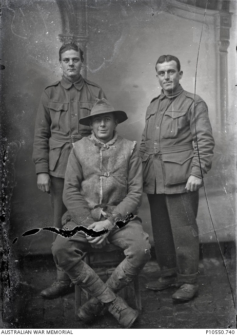 Group portrait of three unidentified Australian soldiers. One wears a ...