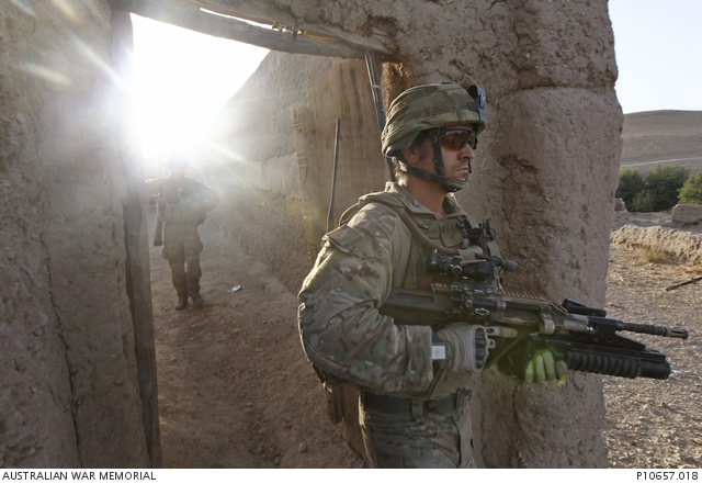 Members of Mentoring Task Force Three (MTF-3) conducting a compound ...