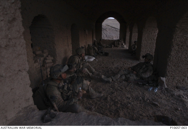 Members of 2RAR, Mentoring Task Force Three (MTF-3), rest in a compound ...