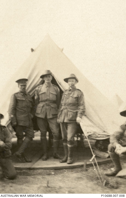 Informal portrait of S M Smith; Sergeant Harry Downes; Cpl Locking ...