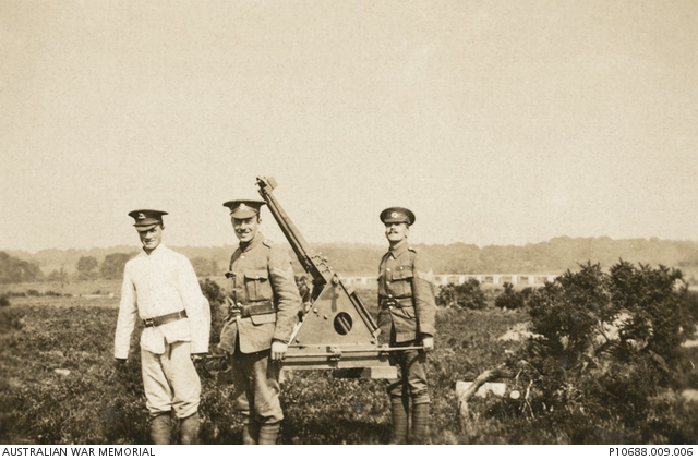A West Spring Gun being carried by three unidentified British soldiers ...