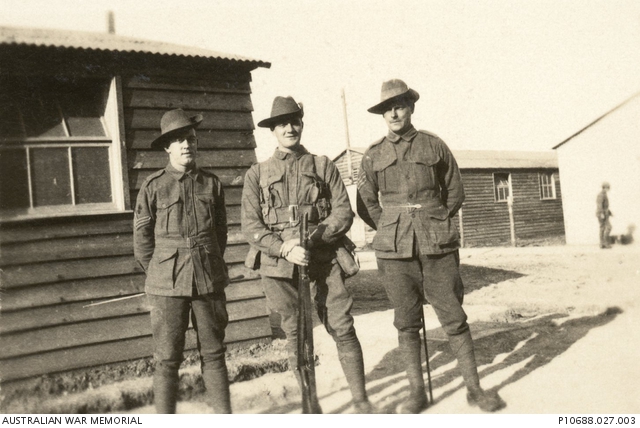 Group portrait of Doug Clark (possibly Douglas Harold Clarke); Harry ...