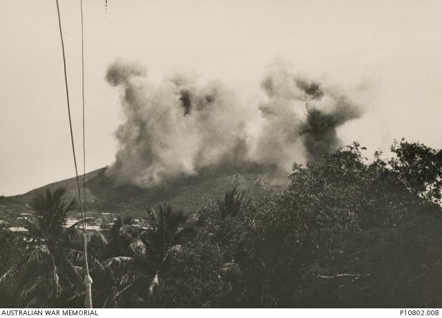 Smoke rises from the remnants of a bombed anti-aircraft battery after ...