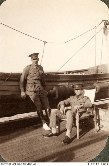 "Jim and Lt Sandy on Ulysses." Informal portrait of Lieutenant (Lt ...