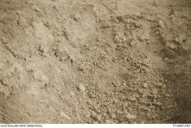 A shell hole made by an allied shell. The depth of the shell hole was ...