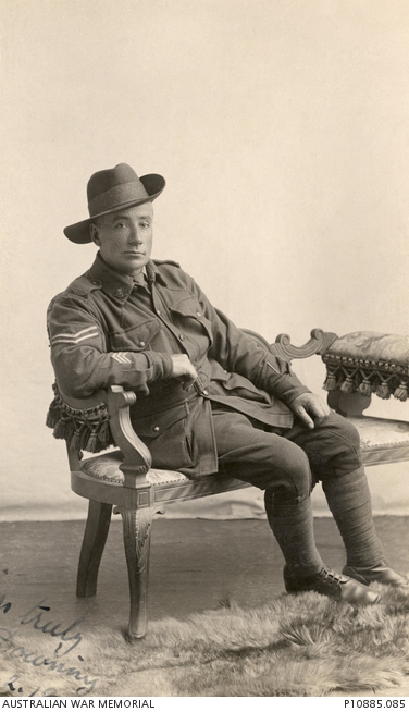Studio portrait of 870 Private William George (Bill) Downing taken while on leave in Ledbury and ...