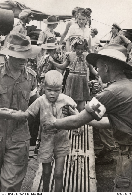 Civilian internees of the Japanese from Menado (Celebes) disembark HMAS ...