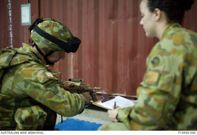 ADF personnel undertake weapons loading and unloading training at a ...