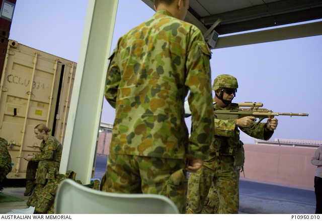 ADF personnel undertake weapons loading and unloading training at a ...