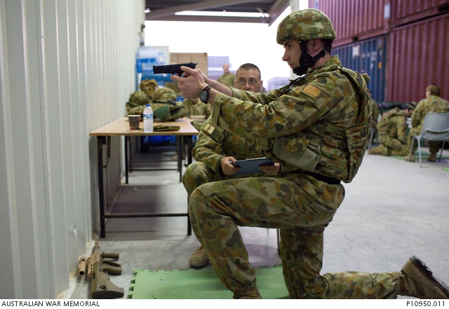 ADF personnel undertake weapons loading and unloading training at a ...