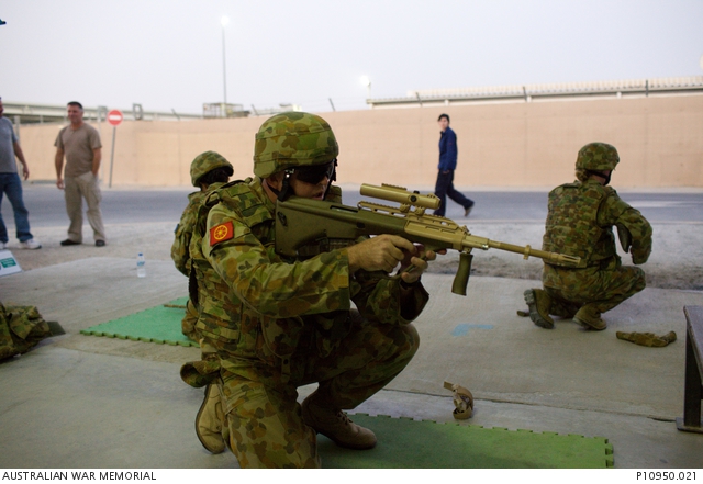 ADF personnel undertake weapons loading and unloading training at a ...