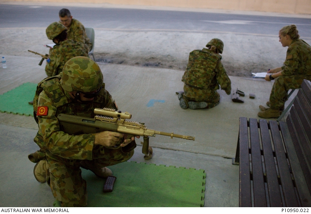 ADF personnel undertake weapons loading and unloading training at a ...
