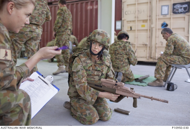ADF personnel undertake weapons loading and unloading training at a ...
