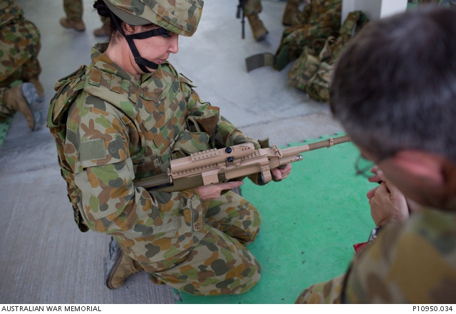 ADF personnel undertake weapons loading and unloading training at a ...