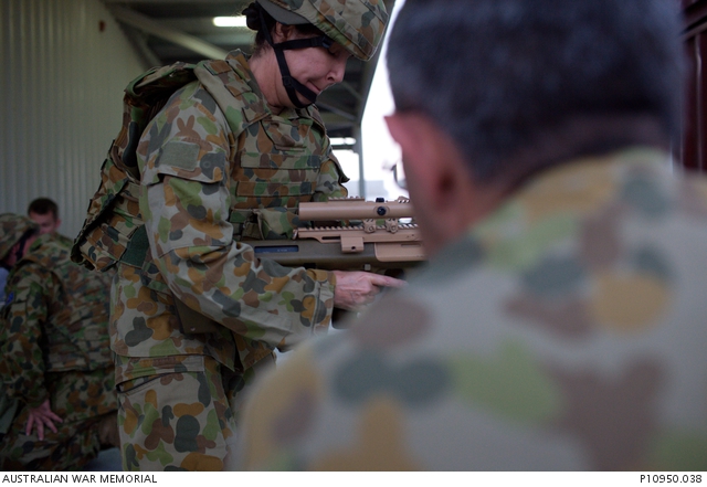 ADF personnel undertake weapons loading and unloading training at a ...