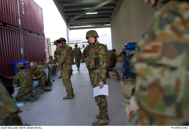 ADF personnel undertake weapons loading and unloading training at a ...