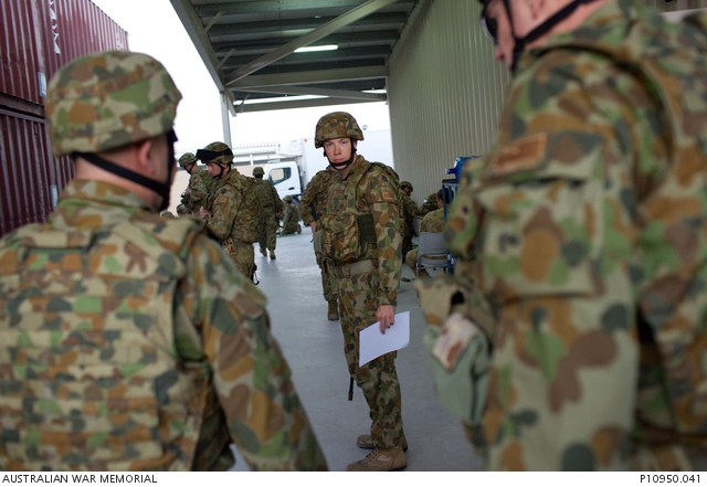 ADF personnel undertake weapons loading and unloading training at a ...