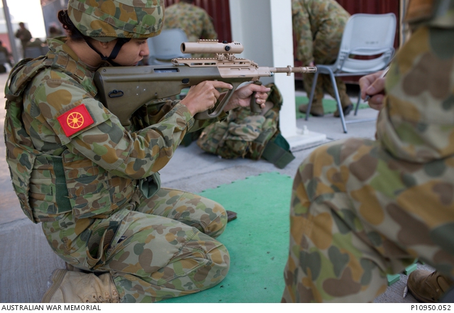 ADF personnel undertake weapons loading and unloading training at a ...