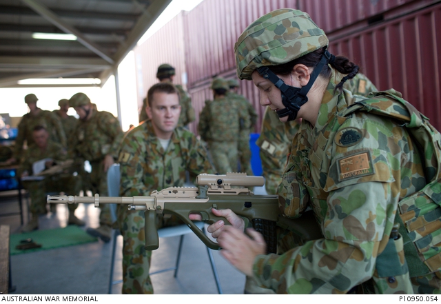 ADF personnel undertake weapons loading and unloading training at a ...