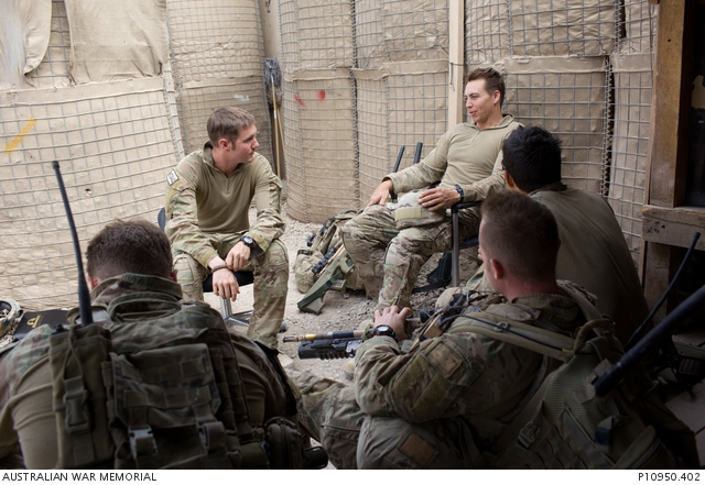 ADF soldiers with full mission kits, body armour and weapons, outside ...