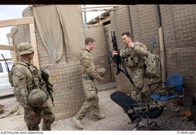 ADF soldiers with full mission kits, body armour and weapons, outside ...