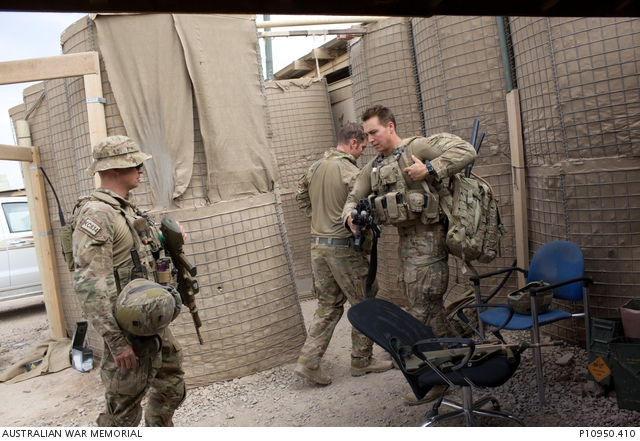 ADF soldiers with full mission kits, body armour and weapons, outside ...