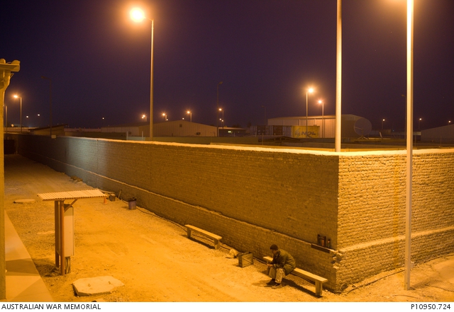 Residences and walls of the Camp Baker compound at night. | Australian ...
