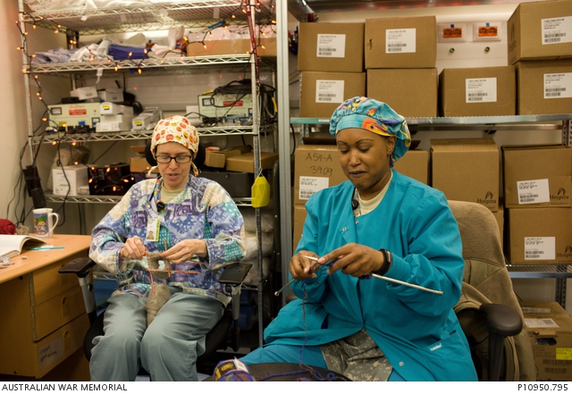 US medical staff knitting at the US run Role III Multinational Medical ...