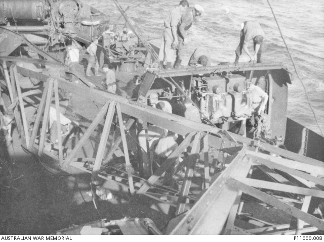 Damage to the crane, probably on the port side, of HMAS Australia ...