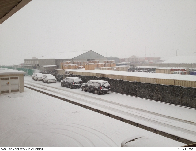 Cars and other facilities covered by falling snow. | Australian War ...