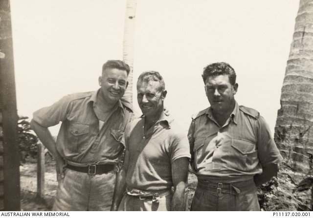 Informal group portrait of VX39344 Warrant Officer Class 2 (WO2) Melvin ...