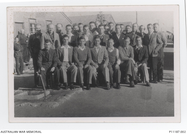 Group portrait of male internees at the Loveday Internment Camp. The ...