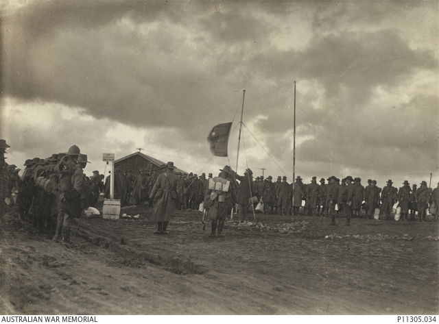 "Pulling down the flag." Staff line up to watch the lowering of the ...