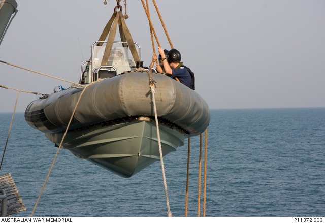 The launch of a Rigid Hull Inflatable Boat (RHIB) from HMAS Parramatta ...