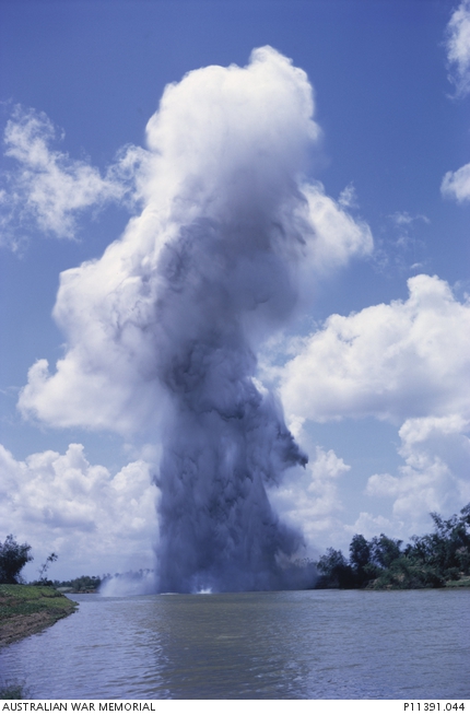 A water spout rises as an explosive charge is detonanted during channel ...