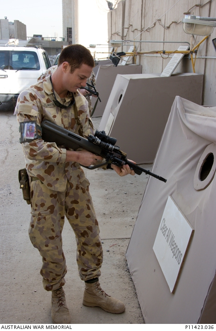 Private/Trooper PTE/TPR(?) Lawrence clearing his Steyr rifle on arrival ...