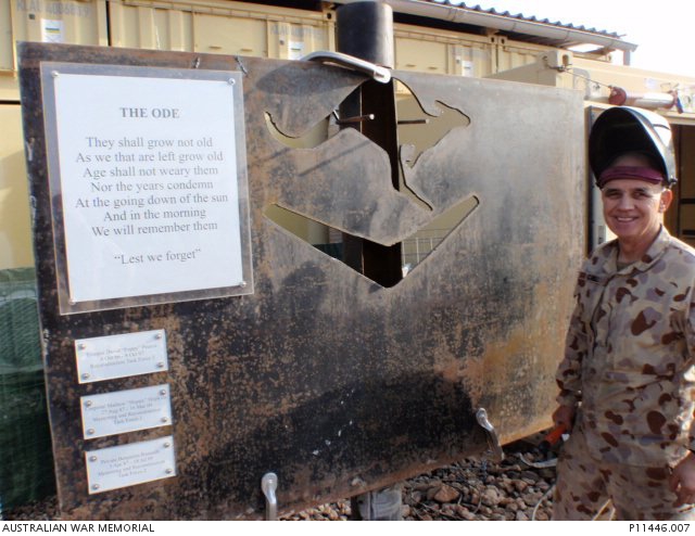 8520859 Corporal (Cpl) Gerard (Gerry) Carroll standing next to the steel memorial he constructed ...