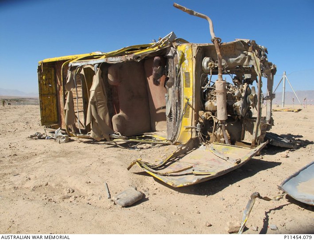The shell of a vehicle likely destroyed by an improvised explosive ...
