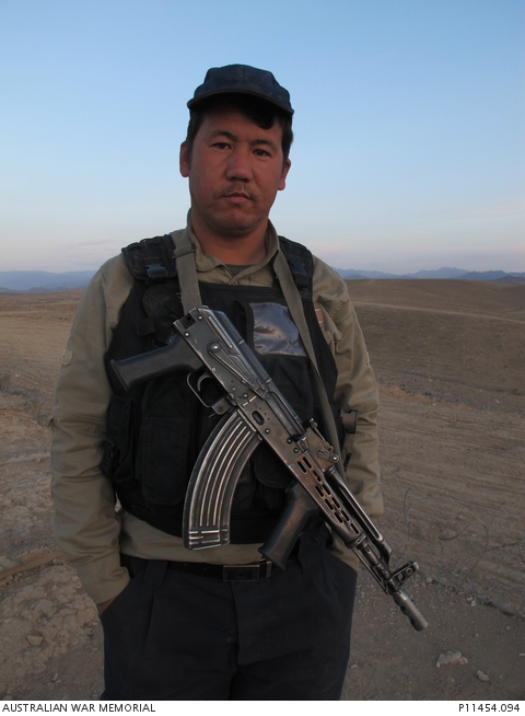 A member of the Afghan security force patrolling the perimeter of Tarin ...