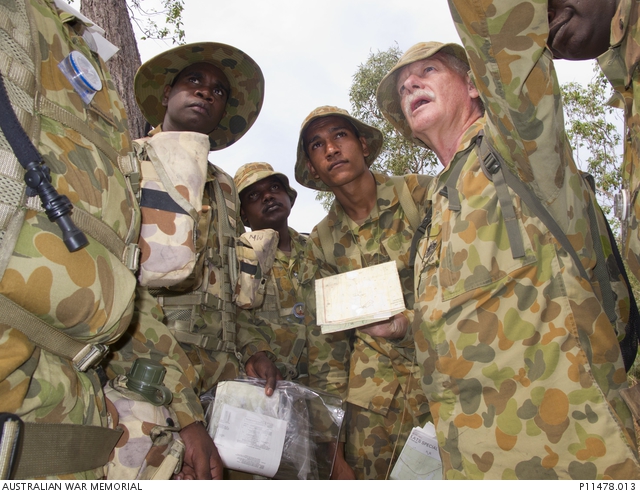 Informal group portrait of NORFORCE recruits being instructed in ...